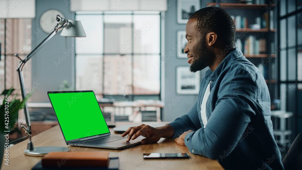Handsome Black African American Specialist Working on Laptop Computer ...
