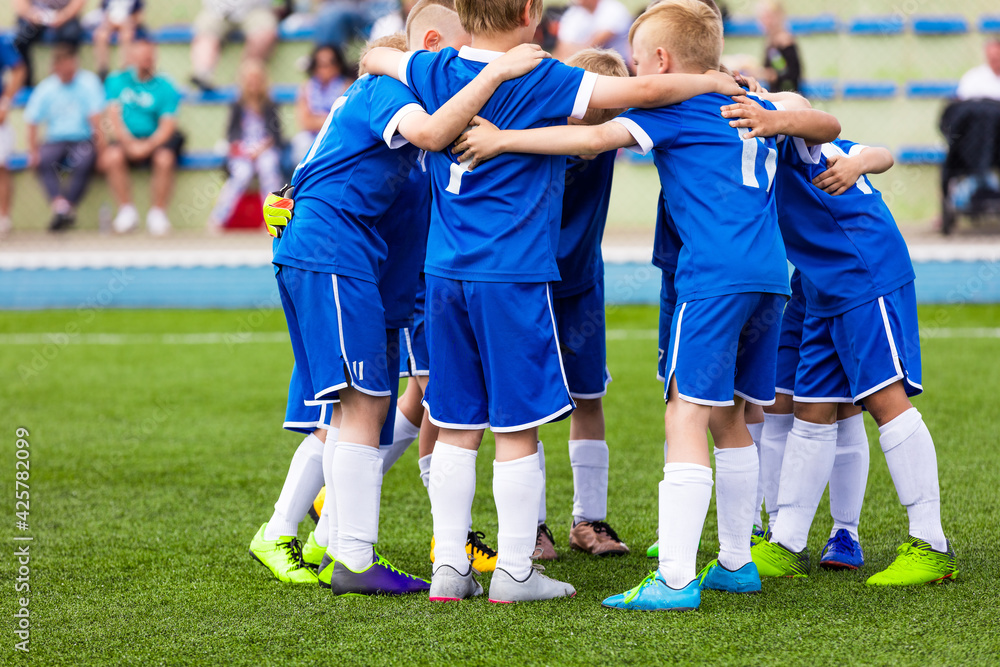 Football Team Players Huddling in a Group. Kids Playing Sports and ...