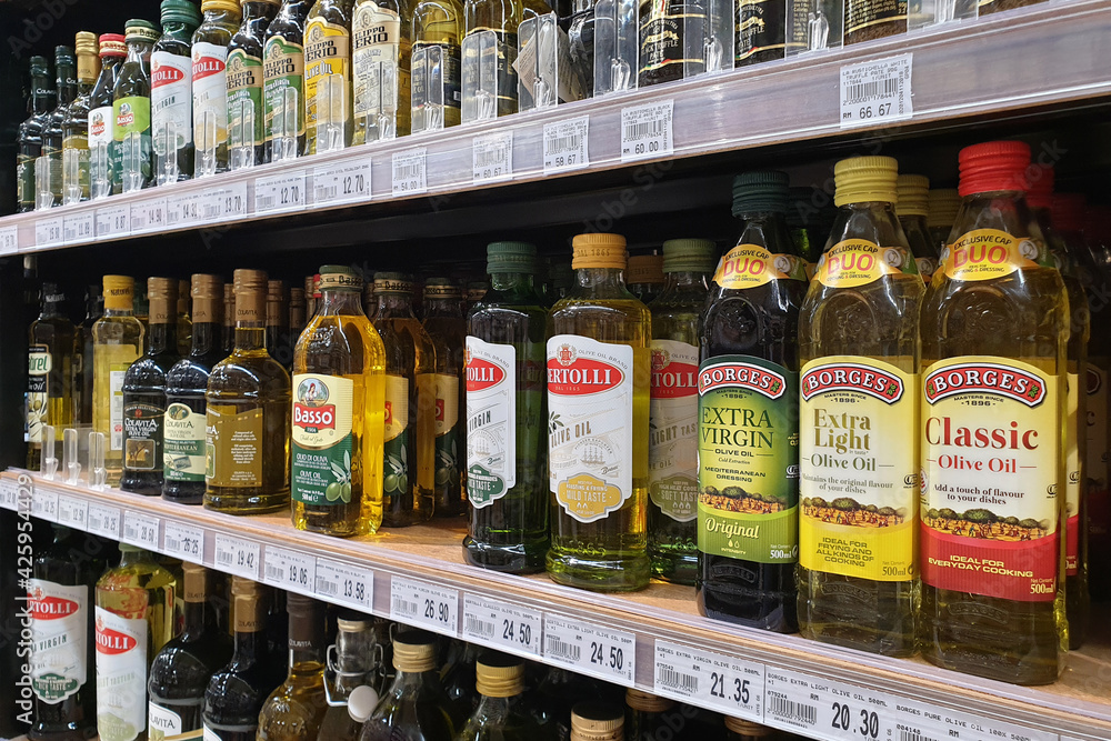 Variety choice of imported Olive Oil on the racks of a local ...