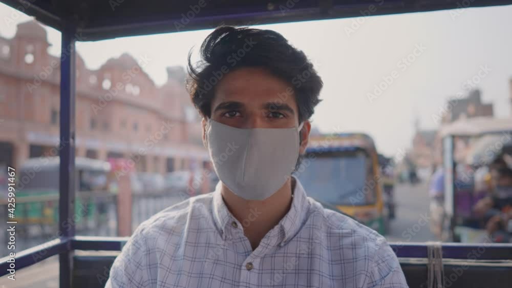Close shot of a young attractive Indian man in formal wear with a ...