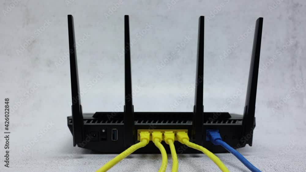 Wireless WIFI Router With Blue Patch Cord In WAN Connector And Yellow ...