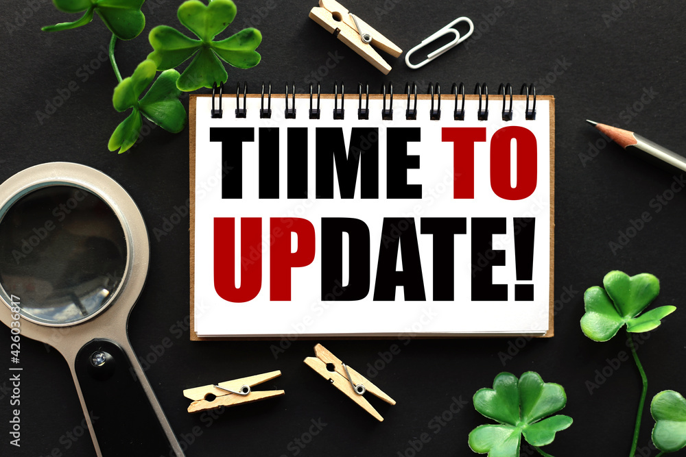 Time for update ! text on white paper on black background. plants ...