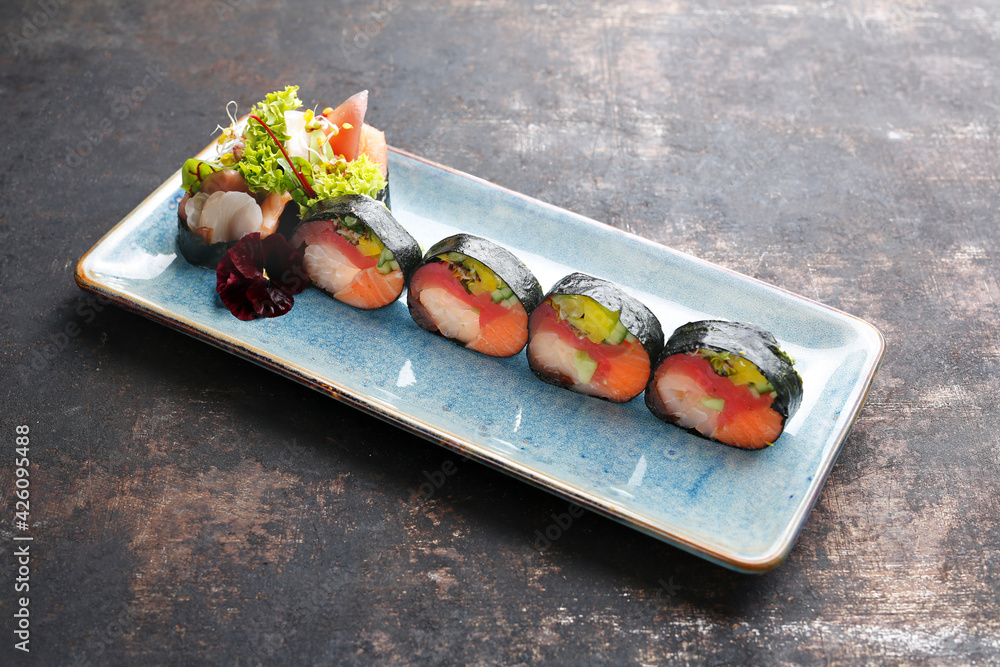 Top view of 6 piece sashimi futomaki set with tuna, salmon, tilapia and ...