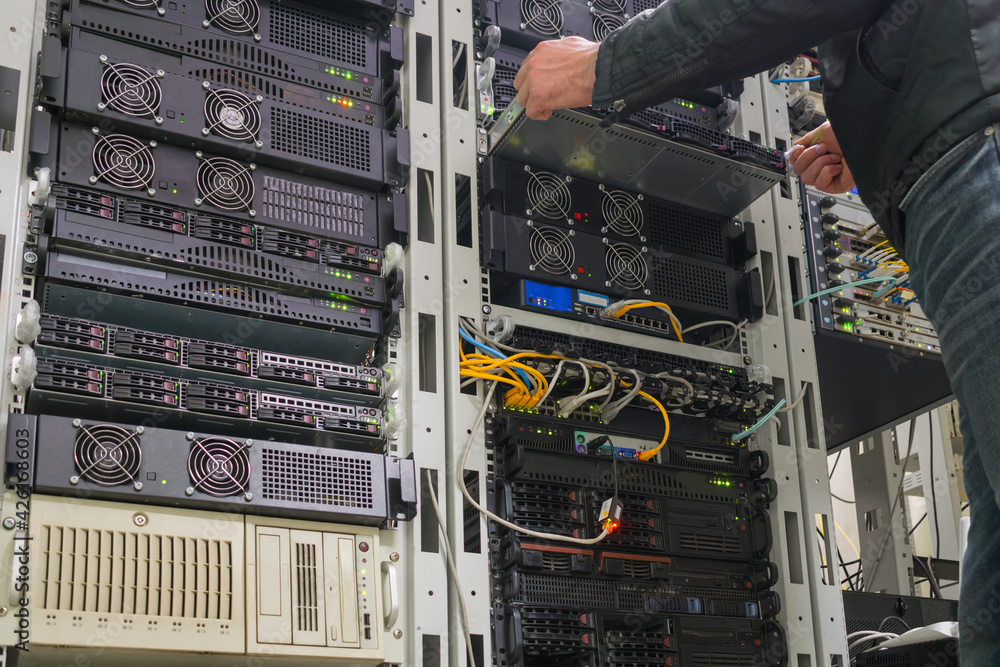 Installing a new setver in the data center rack. Replacement of ...