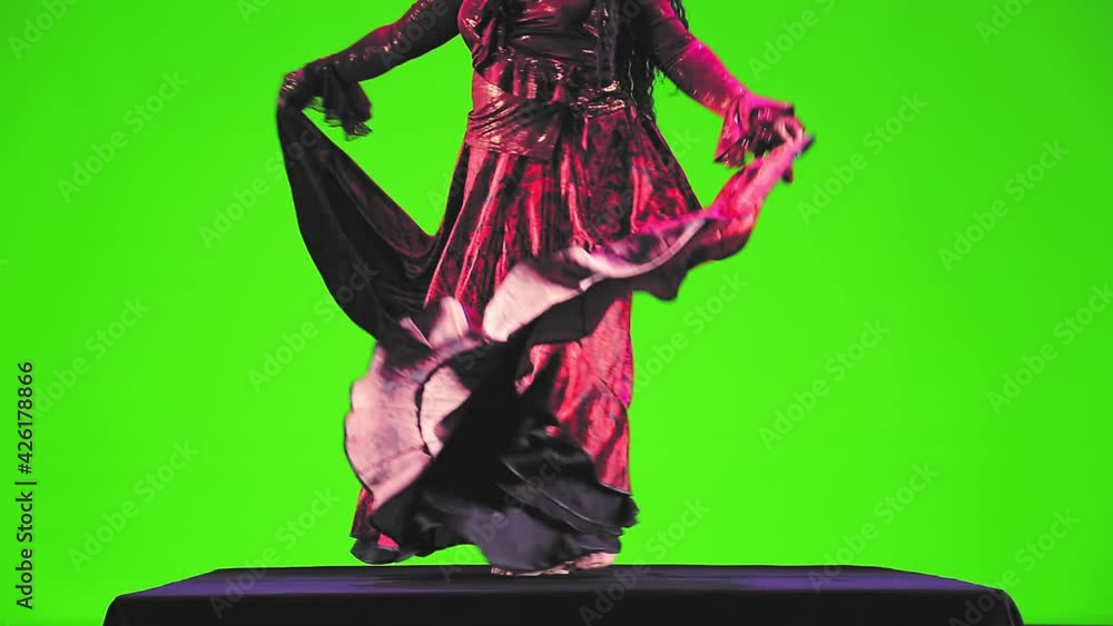 A barefoot gypsy woman without a face with long black hair in a red ...