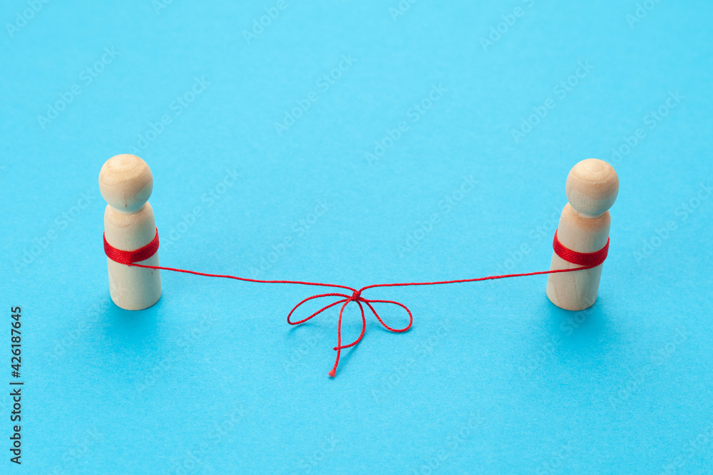 Love in the distance. Two figures of people connected by a thread, best ...