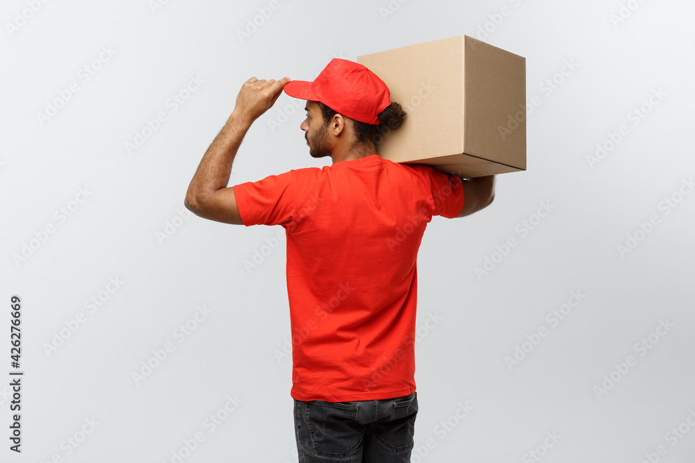 Delivery Concept - back view of Handsome African American delivery man ...