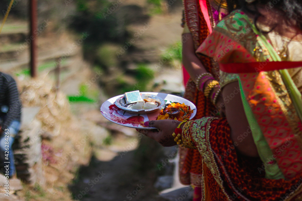 women holding a pooja thali, wedding rituals, wearing red saree Stock ...