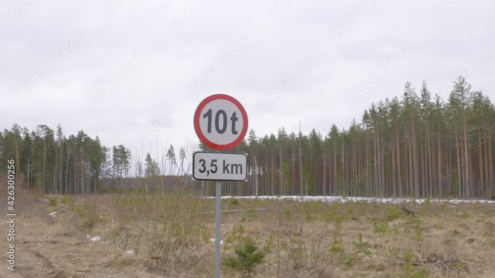 The road signage on the side of the forest road with the 10T and km ...