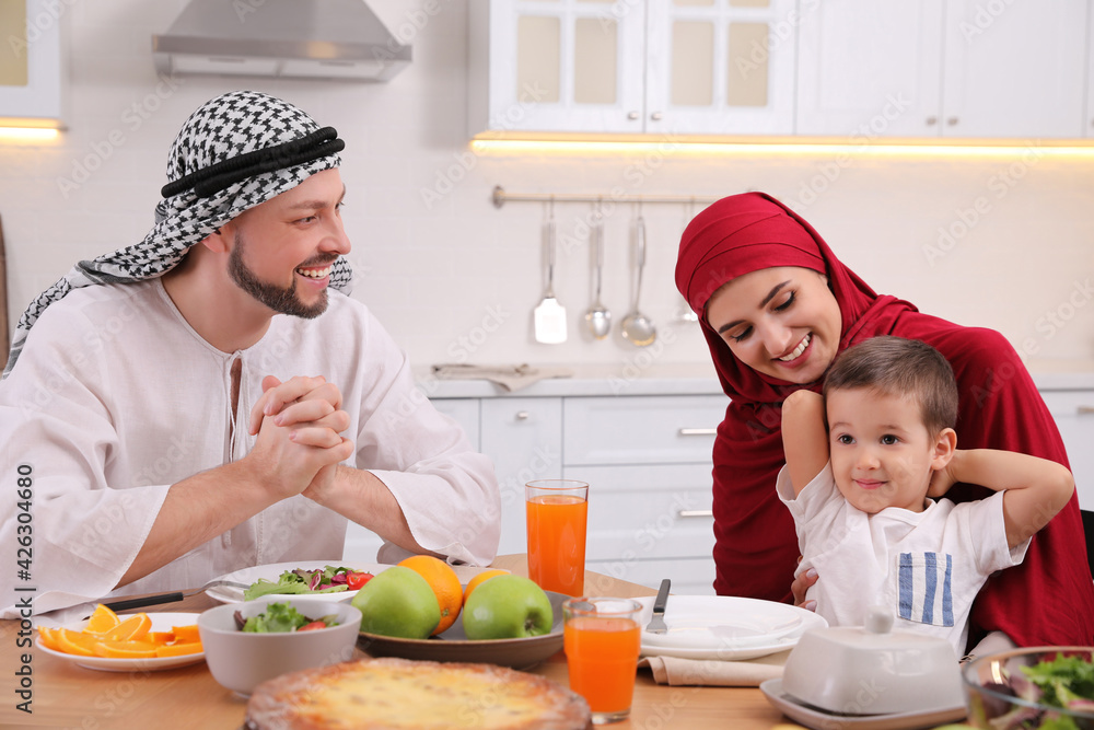 Happy Muslim Family Eating