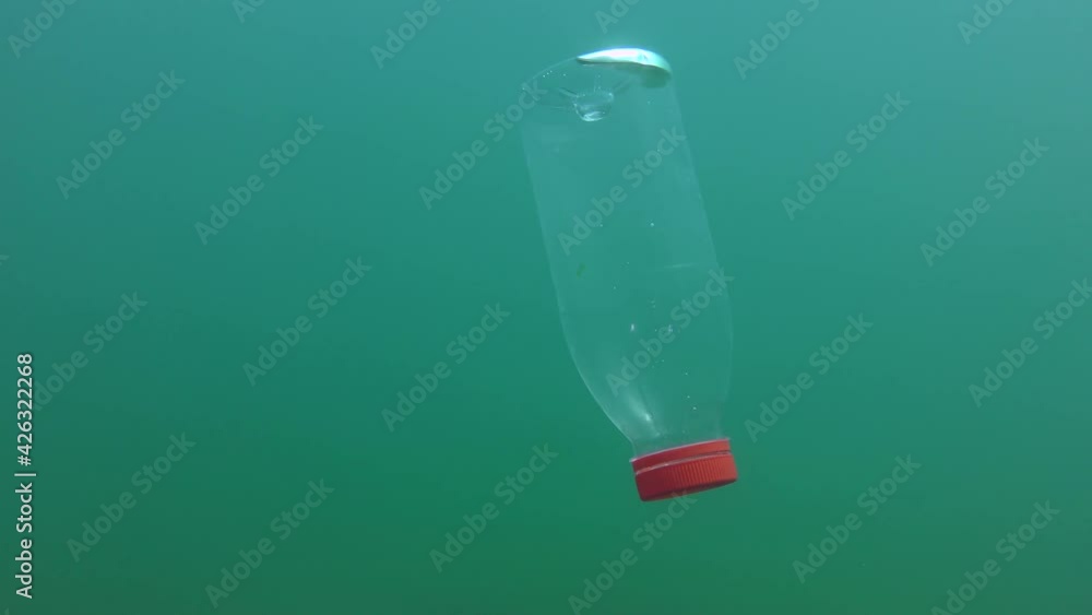 Plastic pollution of the ocean: a PVC bottle slowly sinks to the bottom ...