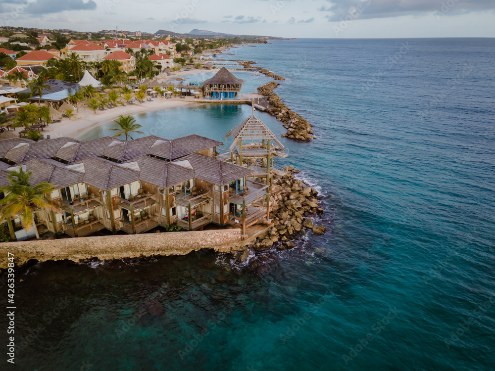 Tropical luxury resort Curacao with private beach and palm trees ...