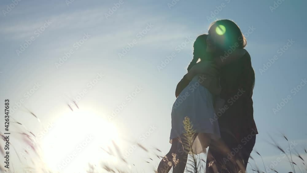 Happy family.silhouette of happy young girl running into arms of her ...