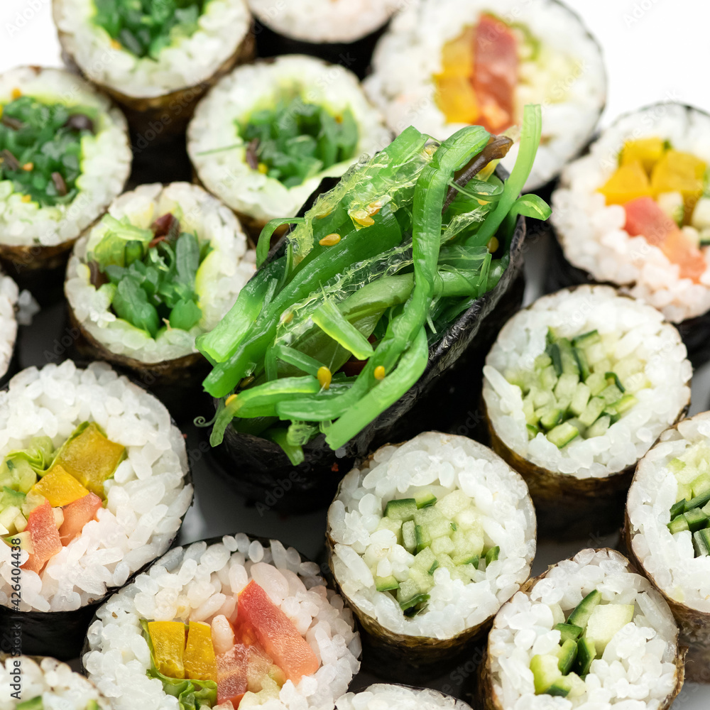 Sushi Set. Different types of sushi rolls and sashimi with seaweed in ...