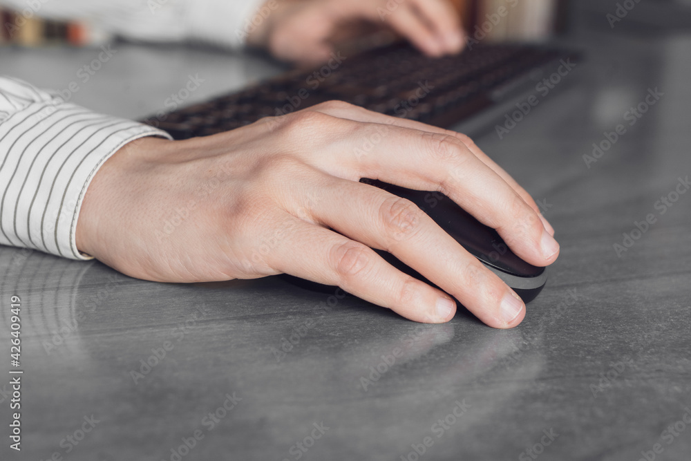 Business woman clicking mouse and typing on keyboard at work Stock ...