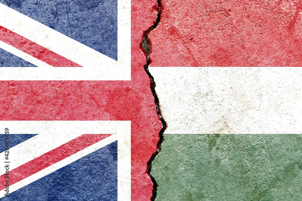 Flags of UK and Hungary on a cracked wall - international political ...
