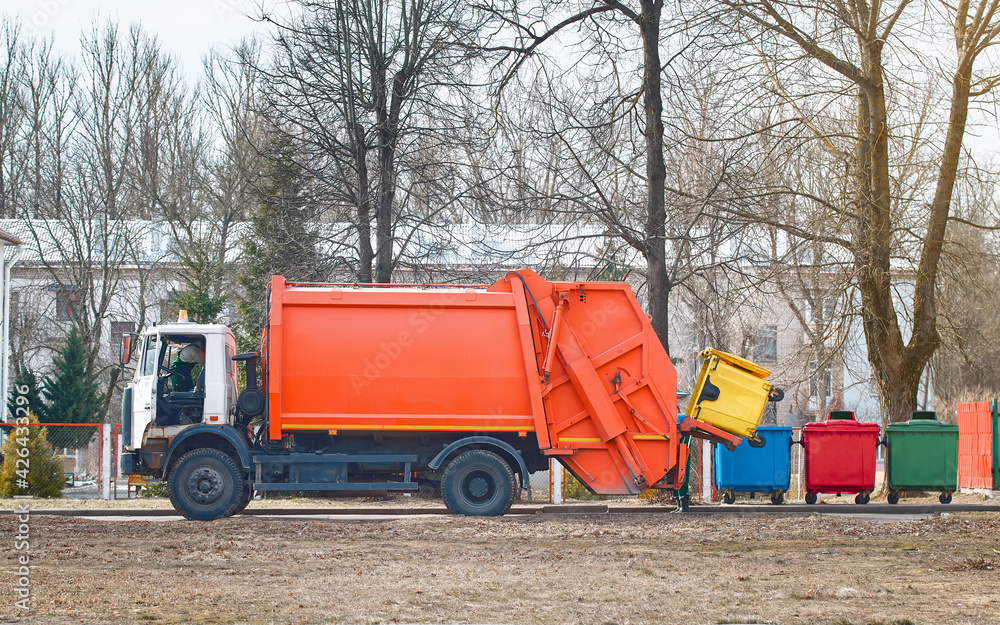 Garbage truck remove waste from city street. Collection and ...
