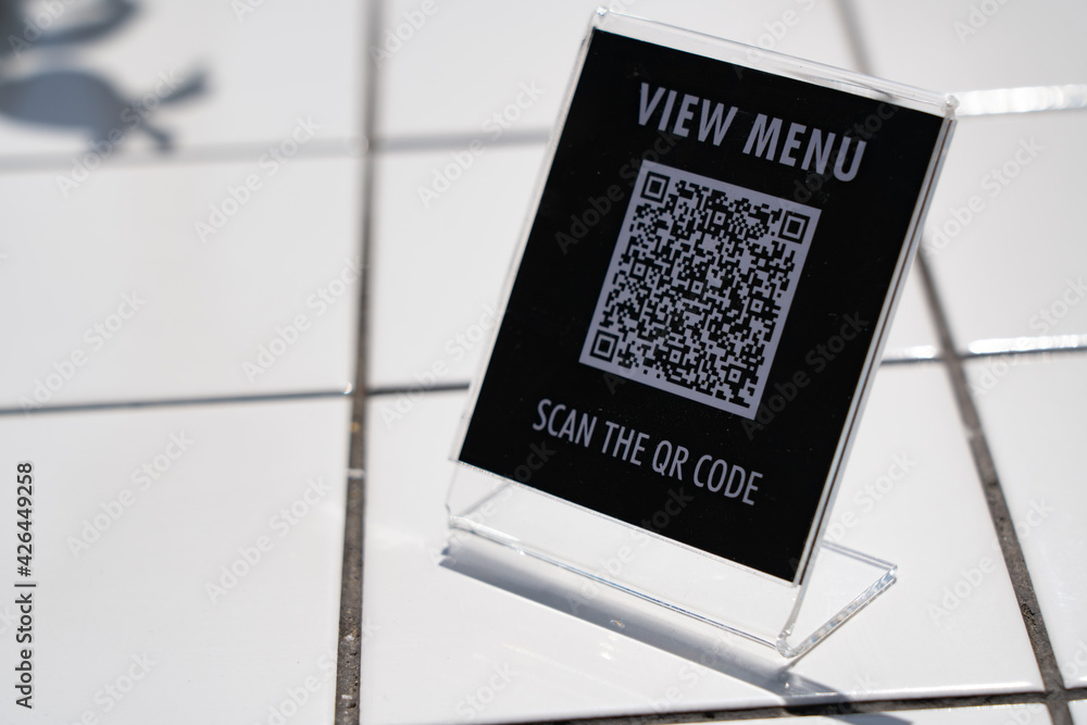 View menu and Scan the QR code sign on the table in the cafe Stock ...