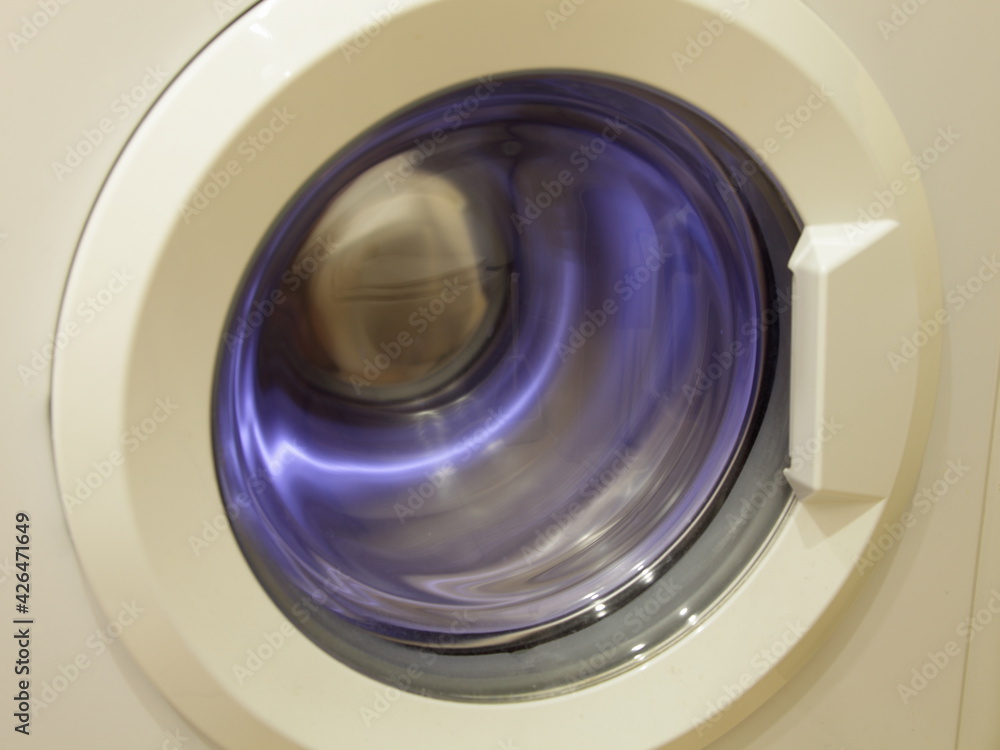 Drying in the washing machine on 800 rpm, rotating drum with blue light ...