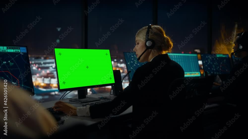 Vídeo do Stock: Female Air Traffic Controller with Headset Works on ...