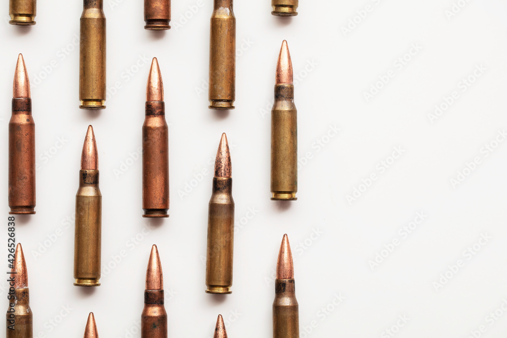 A group of bullet ammunition shells on a white background Stock Photo ...