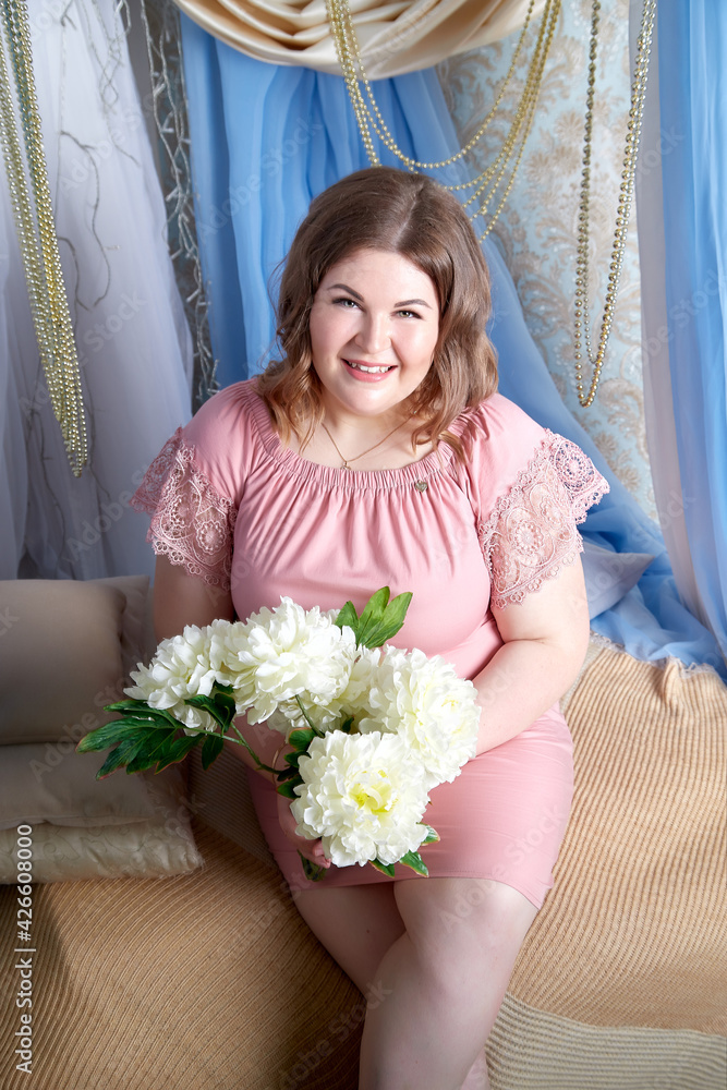 Portrait of fat plump charming cute woman with curly hair in blue ...
