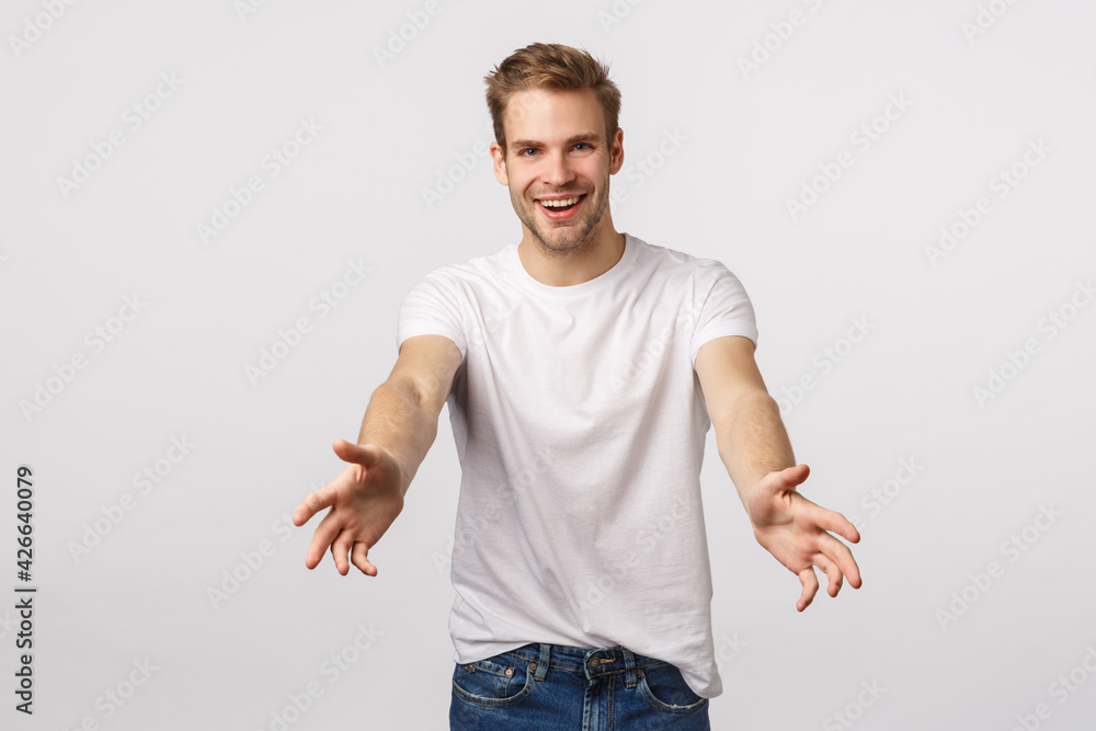 Man suggest lend hand, help out carry something. Joyful charismatic ...