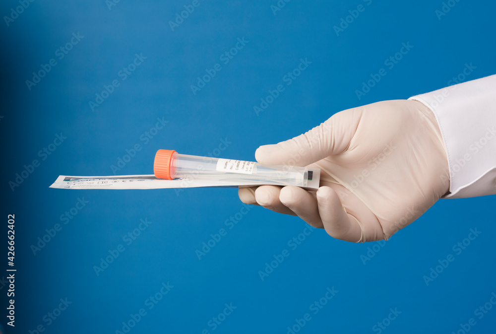 MALAGA, SPAIN- APRIL 8, 2021, doctor's hand with nasal stick for ...