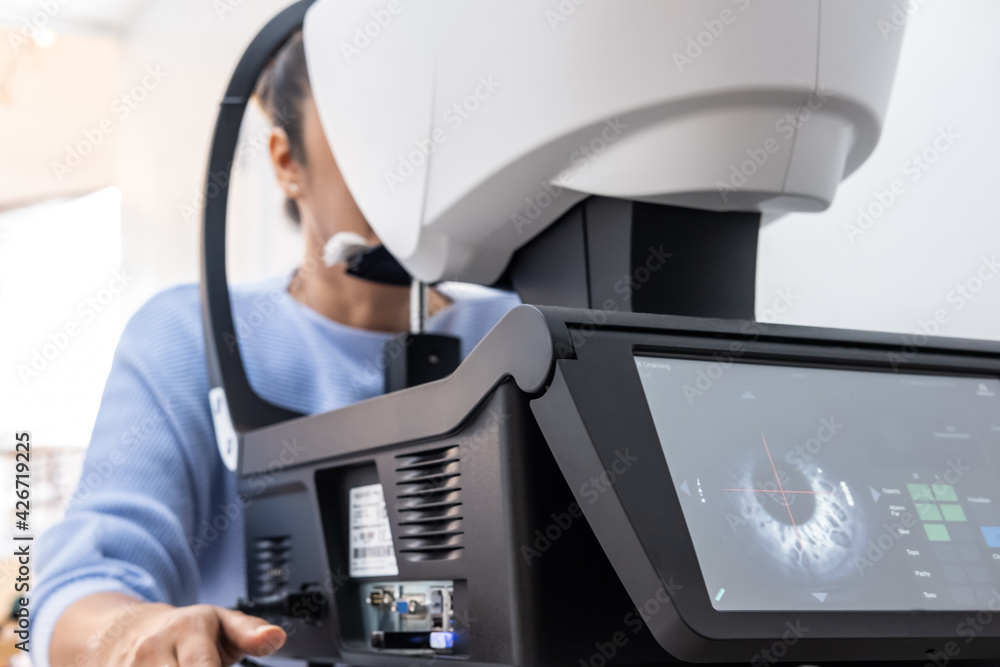 Selective focus at Optometry frame equipment. While doctor using ...