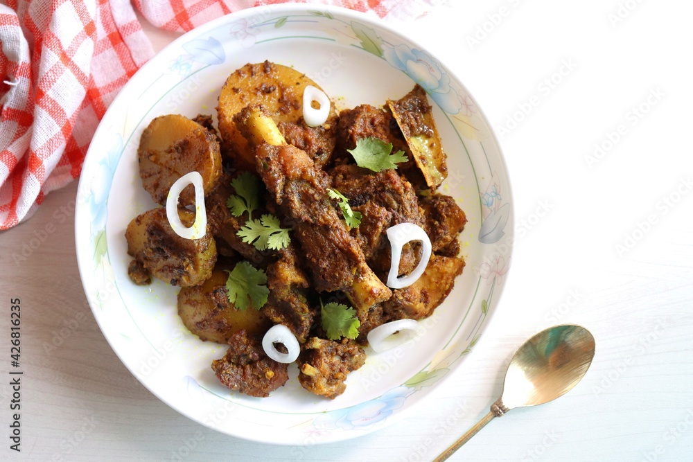 Mutton ghee roast. Goat meat fry with potatoes, also known as Mutton ...
