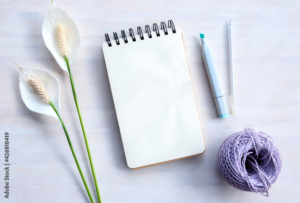 Blank spiral notepad with white paper. Notepad with pen and white ...