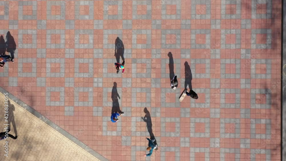 Shadow cast from kids training movement skills to propel the board, and ...