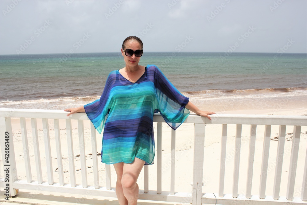 plus size curve woman model on beach resort balcony in swimsuit and ...