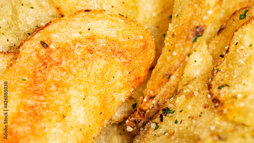 Natural fat potato chips with salt, black pepper, herbs and vegetable ...