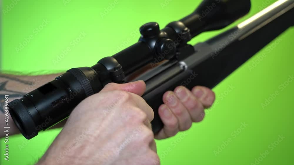 Reloading rifle by pulling back endpiece and putting new cartridge into ...