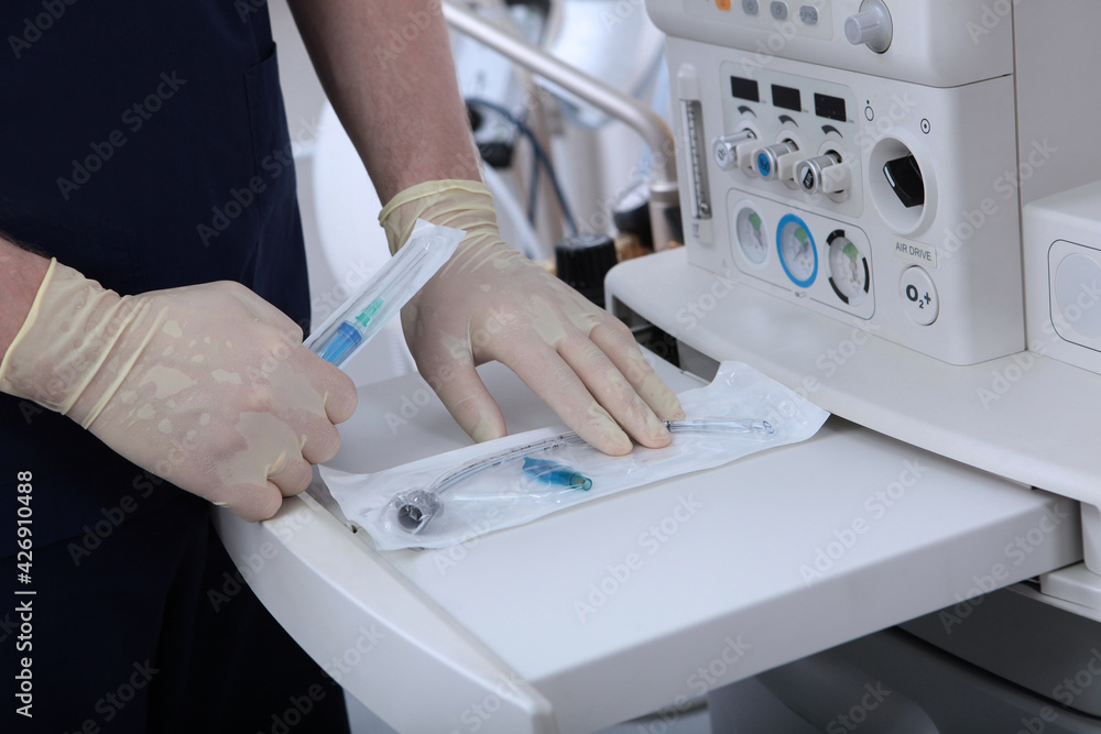 Pull-out panel on the ventilator to accommodate medical devices ...