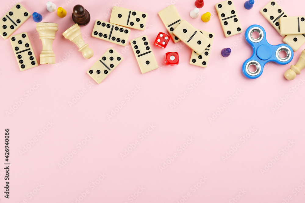 Components of board games on pink background, flat lay. Space for text ...
