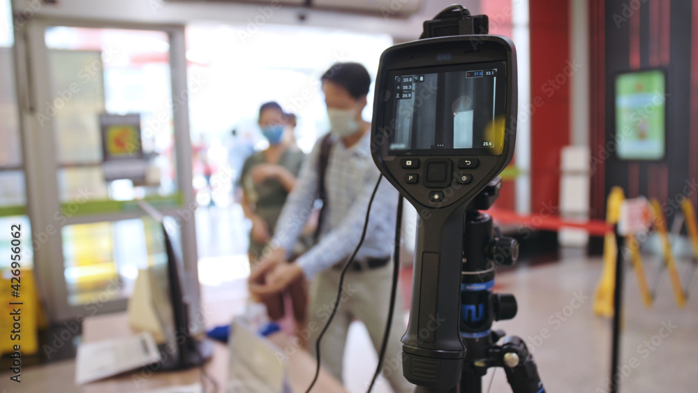 Temperature check at a supermarket, grocery store with a thermal ...