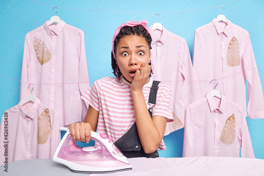 Household and housekeeping concept. Nervous worried housemaid with ...