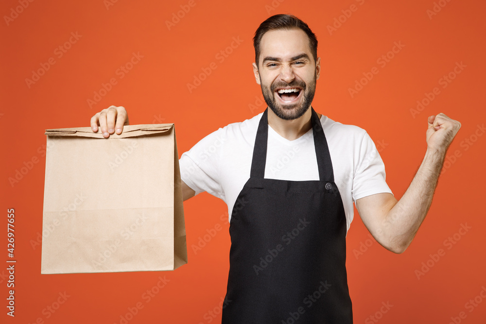 Young fun man barista bartender barman employee in apron white t-shirt ...