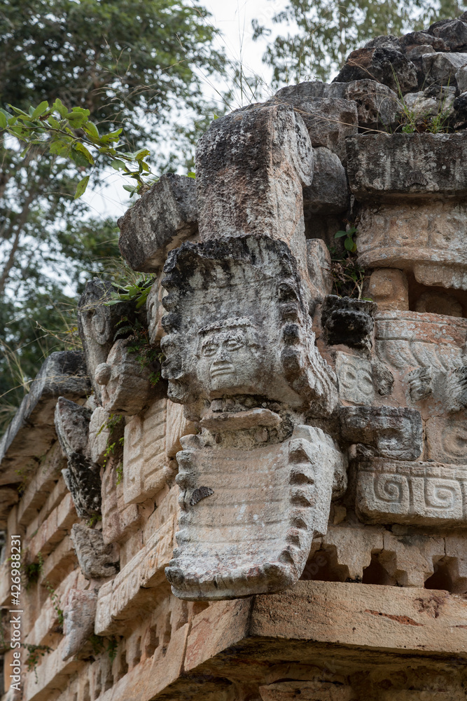 Kukulcan mask representing a face in a crocodile mouth, at mayan temple ...