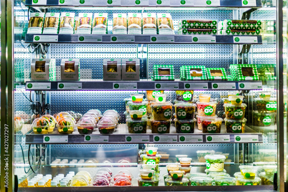 Pre-packaged foods displayed in a commercial refrigerator Stock Photo ...
