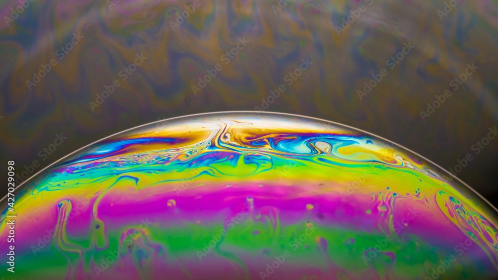 Fluid soap bubble looking like planets. Psychedelic colorful abstract ...