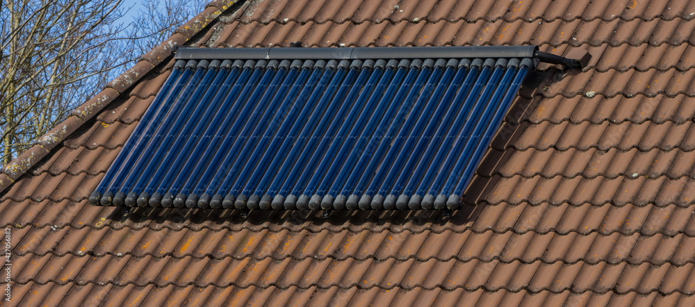 evacuated tube collector on a roof, solar thermal, solar water system ...