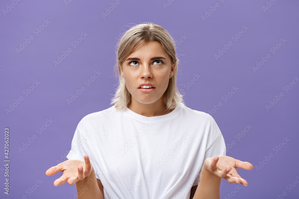 Nah I have no idea. Portrait of irritated bothered good-looking ...