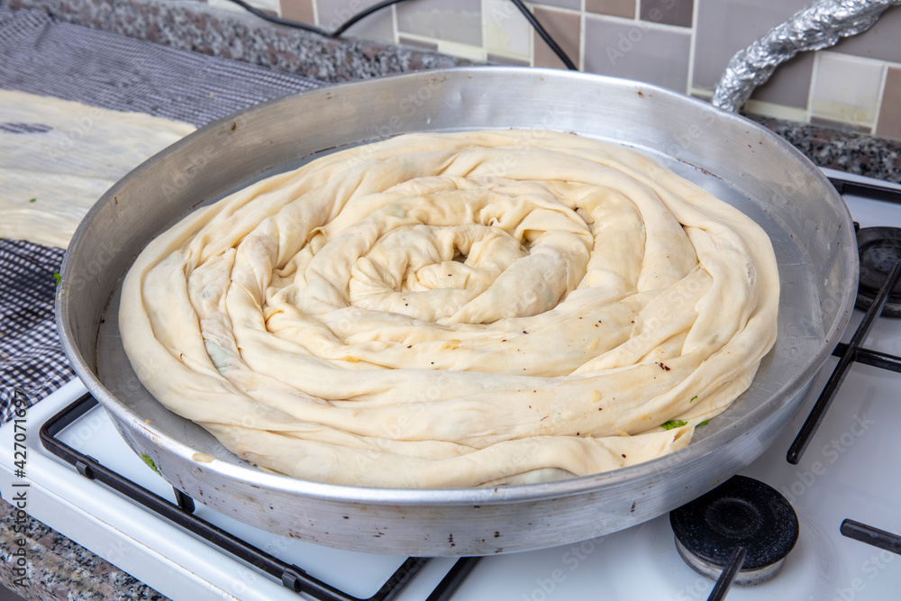 Bosnian borek. Homemade rolled borek, spinach, potato and feta cheese ...