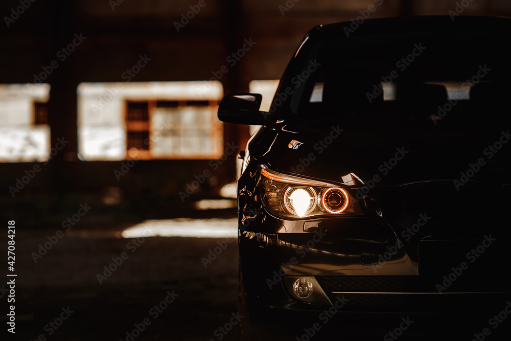 Headlights of black modern car close up. Modern luxury car close-up ...