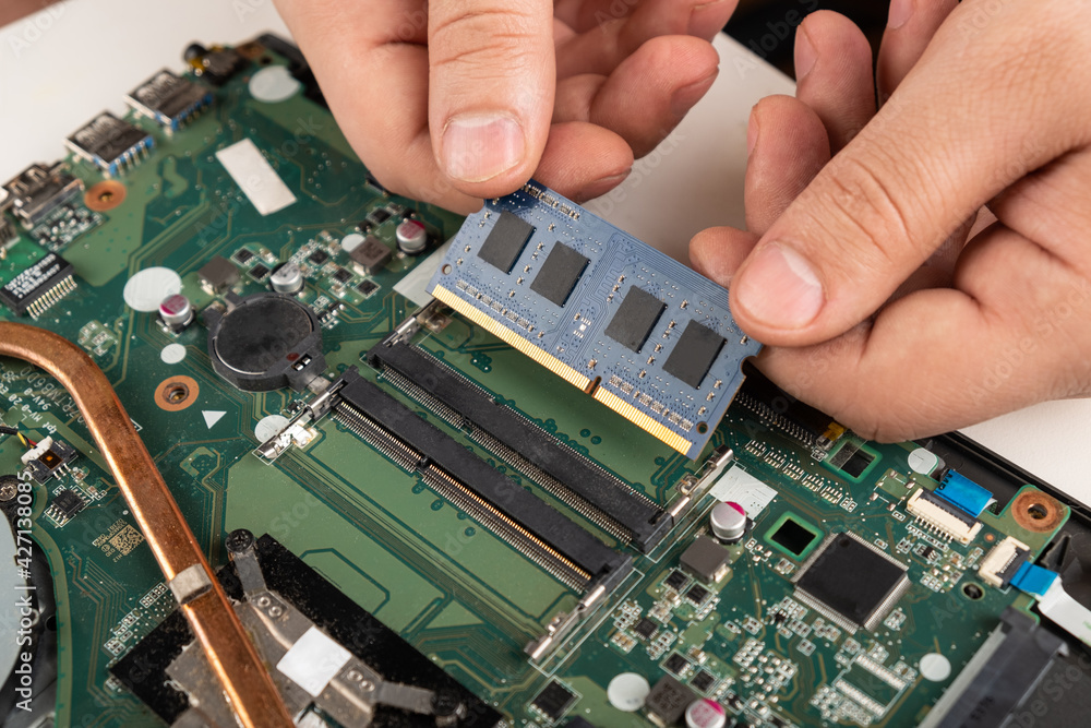 installing RAM in a laptop,improve laptop performance. Stock Photo ...