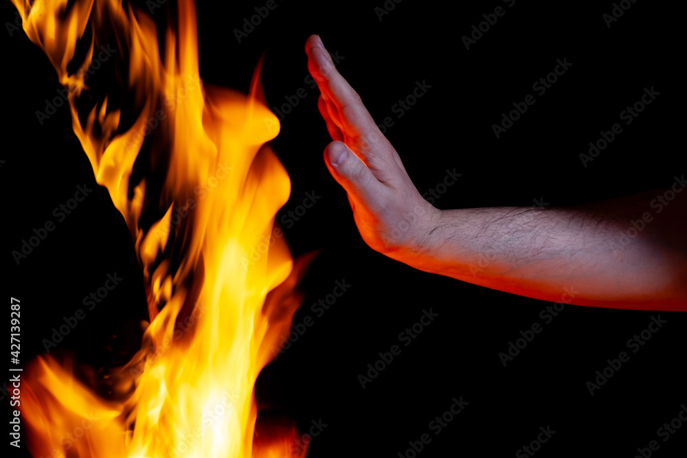 human hand and burning flame, use as a poster Stock Photo | Adobe Stock