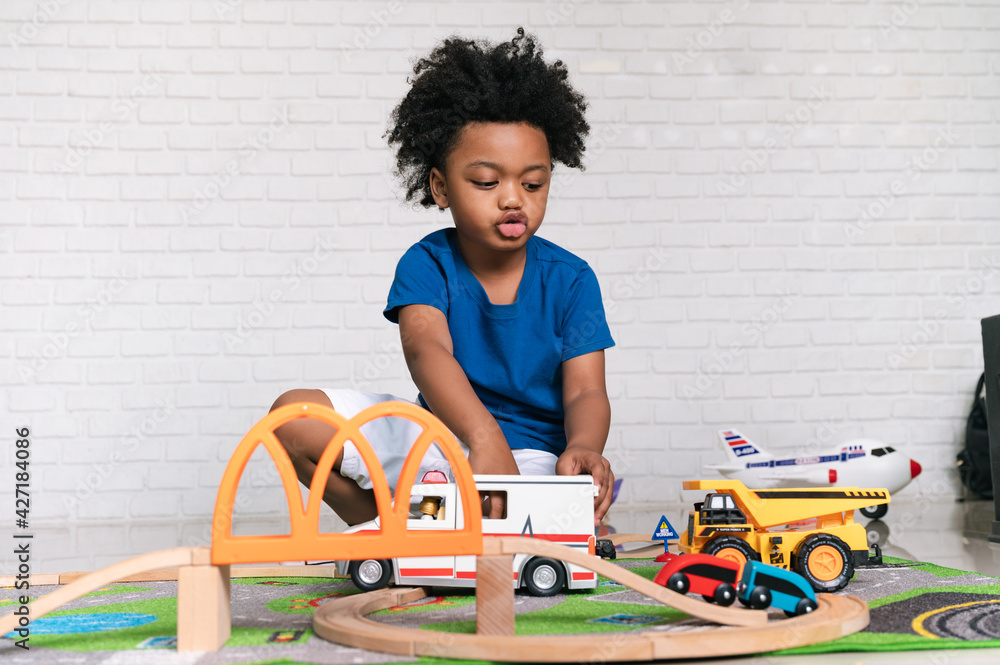 Happy black people African American child play toy at home Stock Photo ...